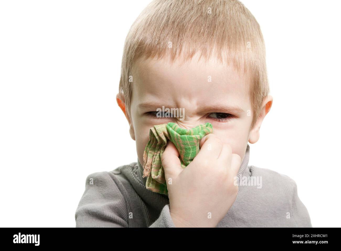 Human child cold flu illness tissue blowing nose Stock Photo - Alamy