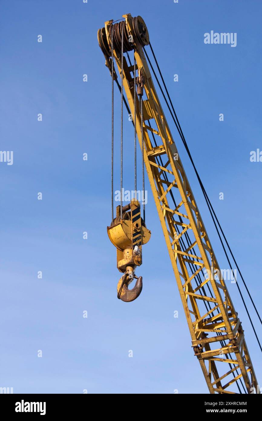 Tower crane with steel hook building metal construction Stock Photo - Alamy
