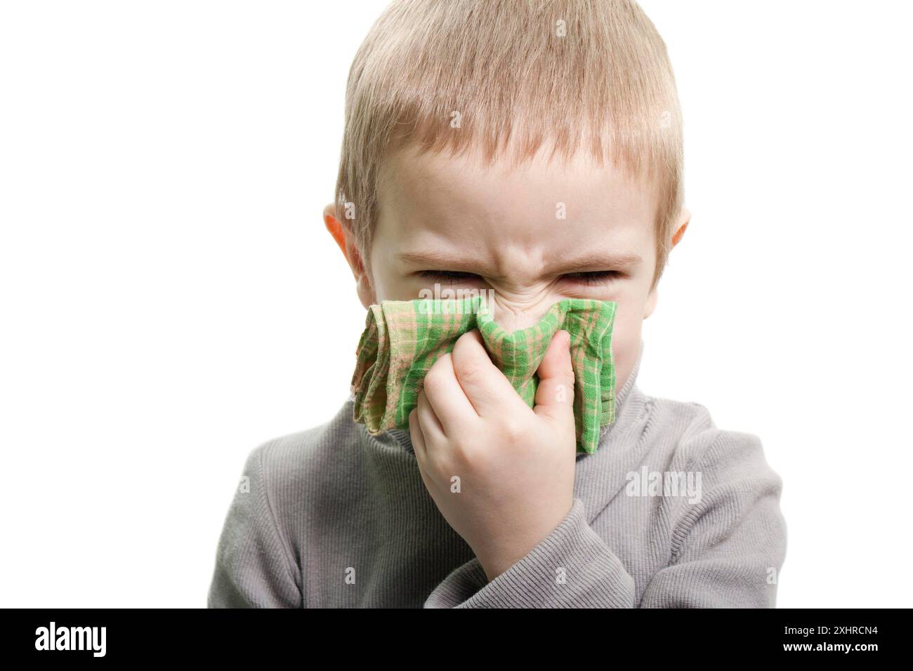 Human child cold flu illness tissue blowing nose Stock Photo - Alamy
