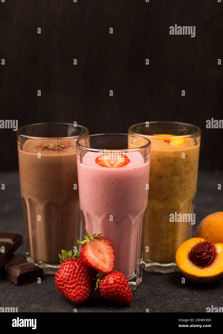 Front view assortment milkshakes with chocolate fruits Stock Photo - Alamy