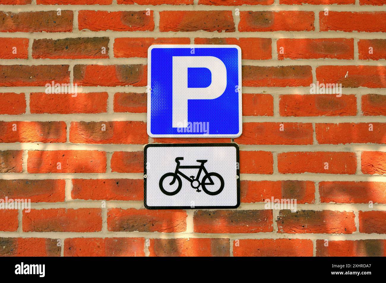 Street sign, Devizes. Parking sign cycling sign against a red brick ...
