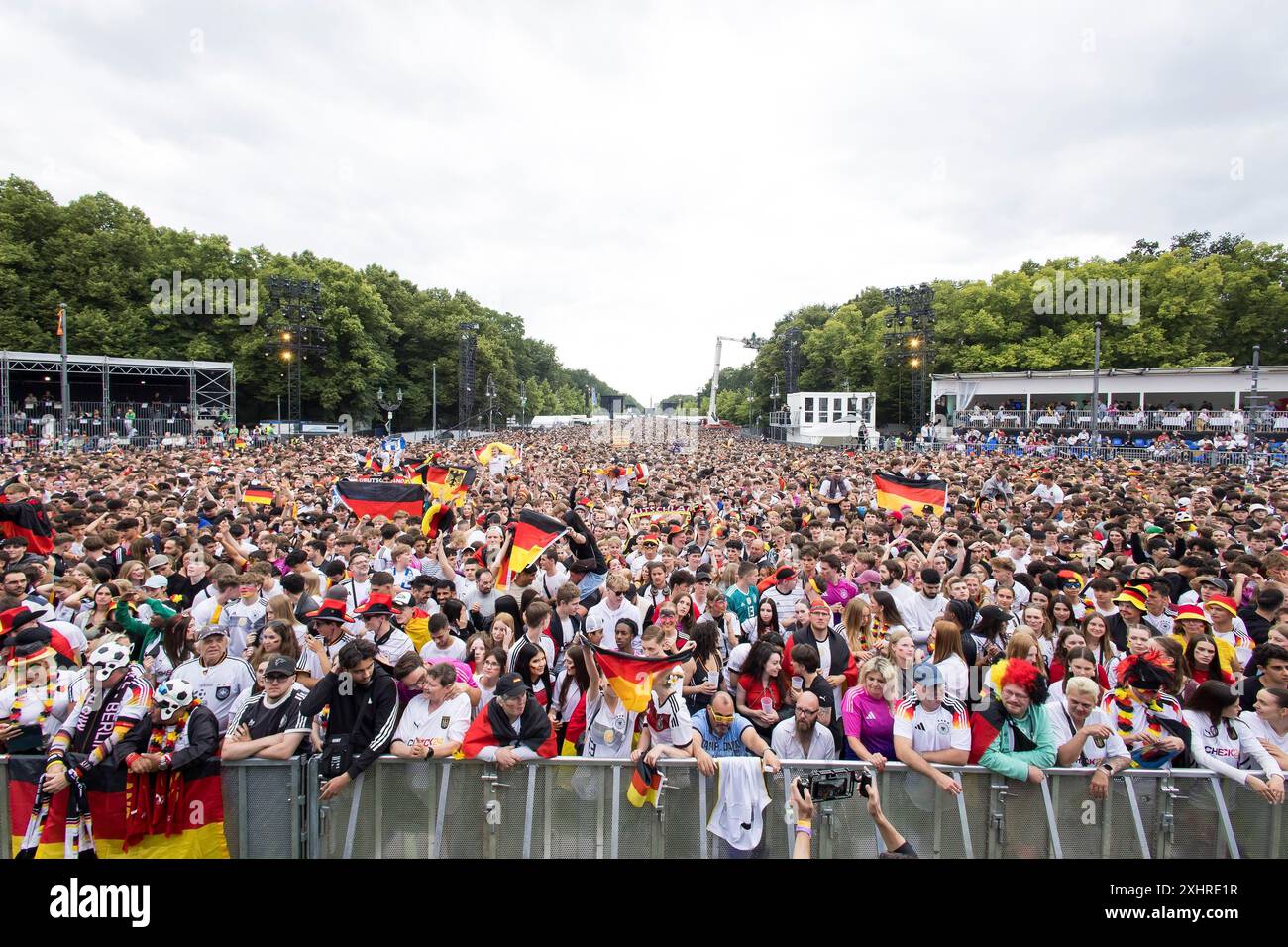 Football fans in the fan zone at the Brandenburg Tor during the quarter ...