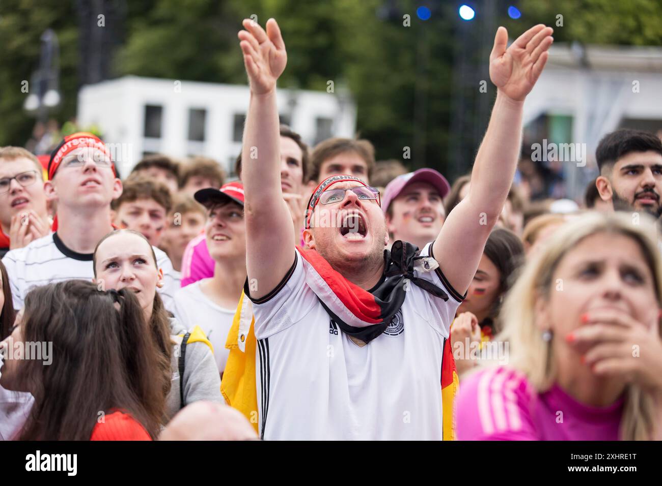 Football fans in the fan zone at the Brandenburg Tor during the quarter ...