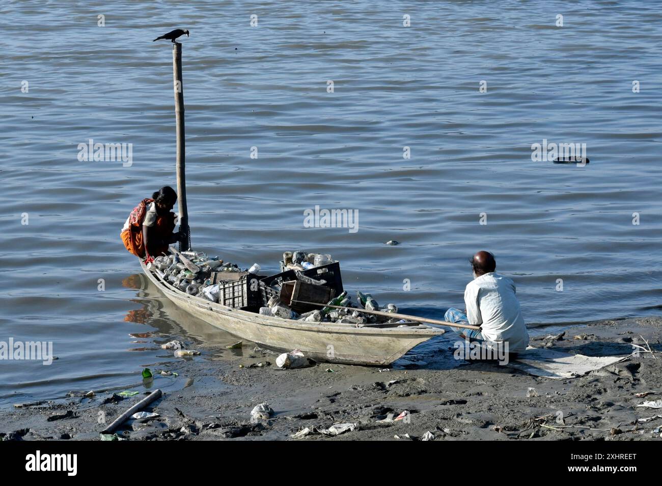 Man and women rag picker collecting plastic bottle and other plastic ...