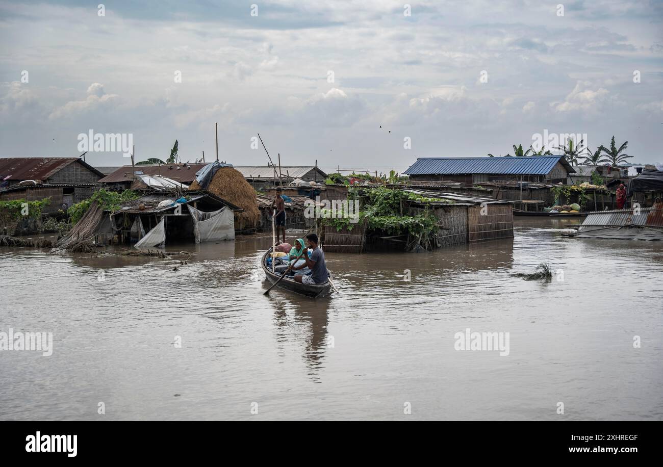 Morigaon, India. 4 July 2024. A settlement is partially submerged in ...