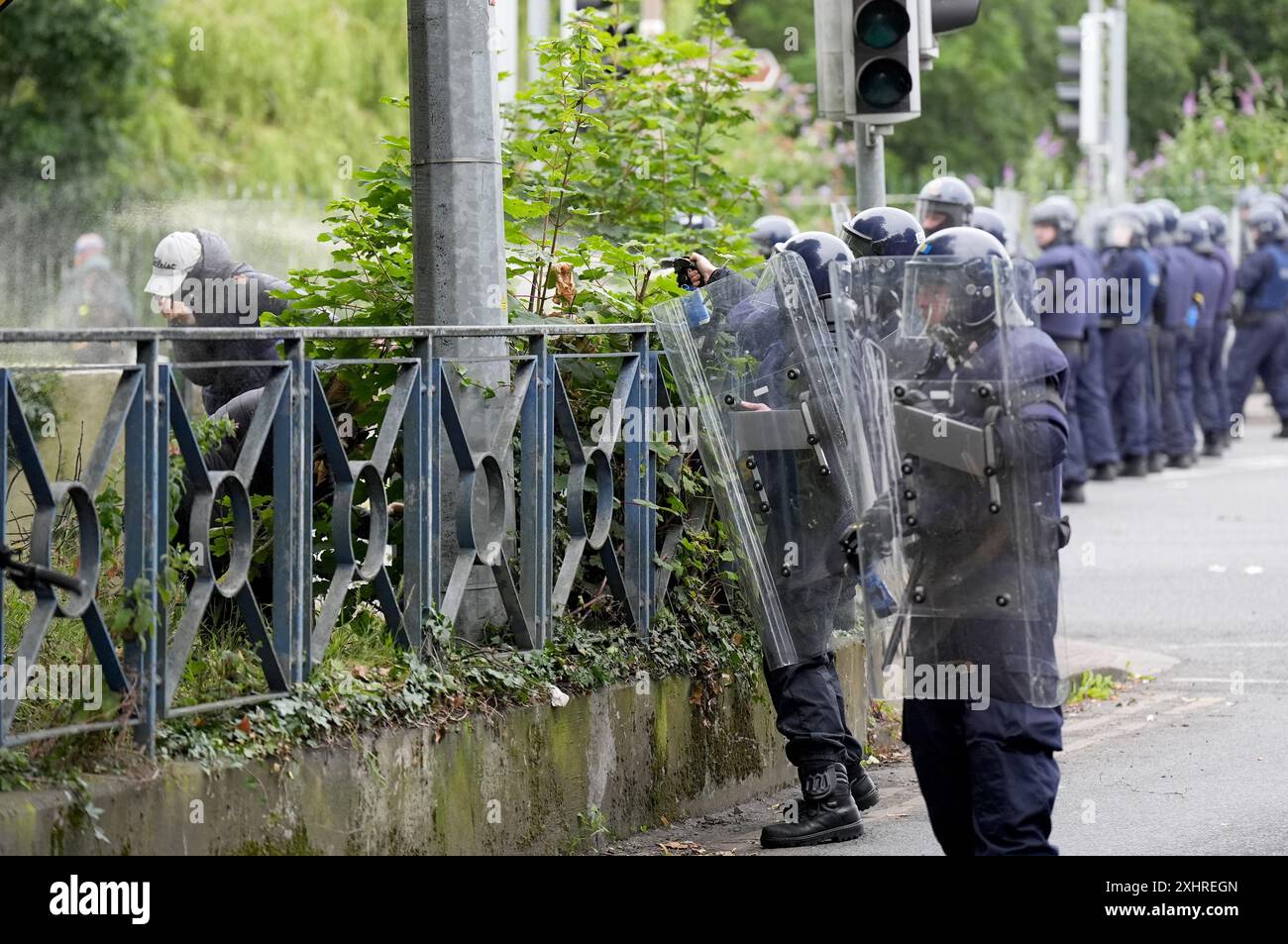 Gardai public order unit officers deploy pepper spray at a protesters ...