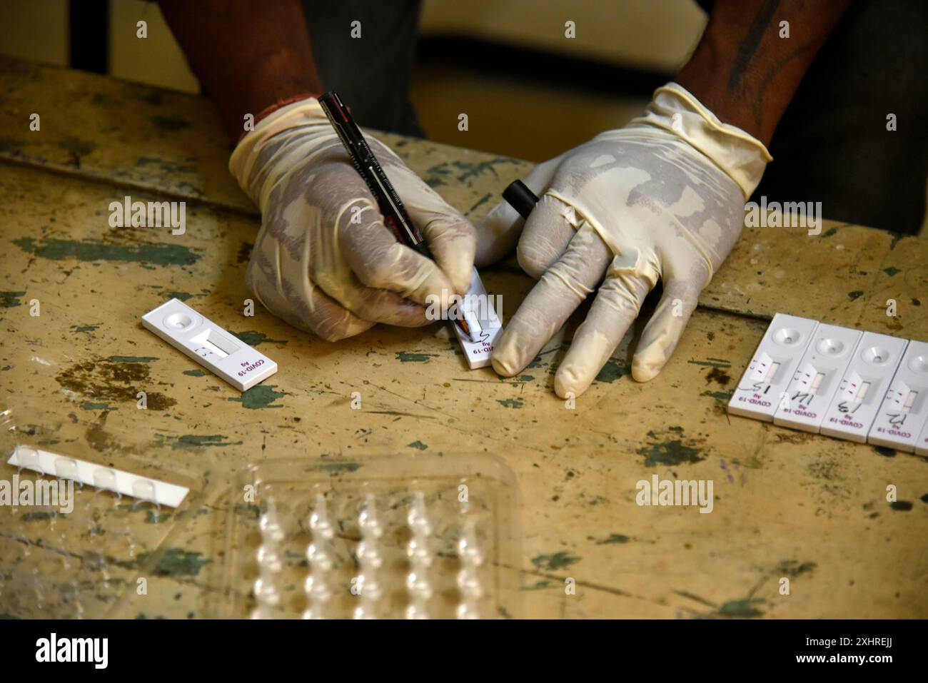 A health worker working before Covid-19 Rapid Antigen Testing (RAT), at ...