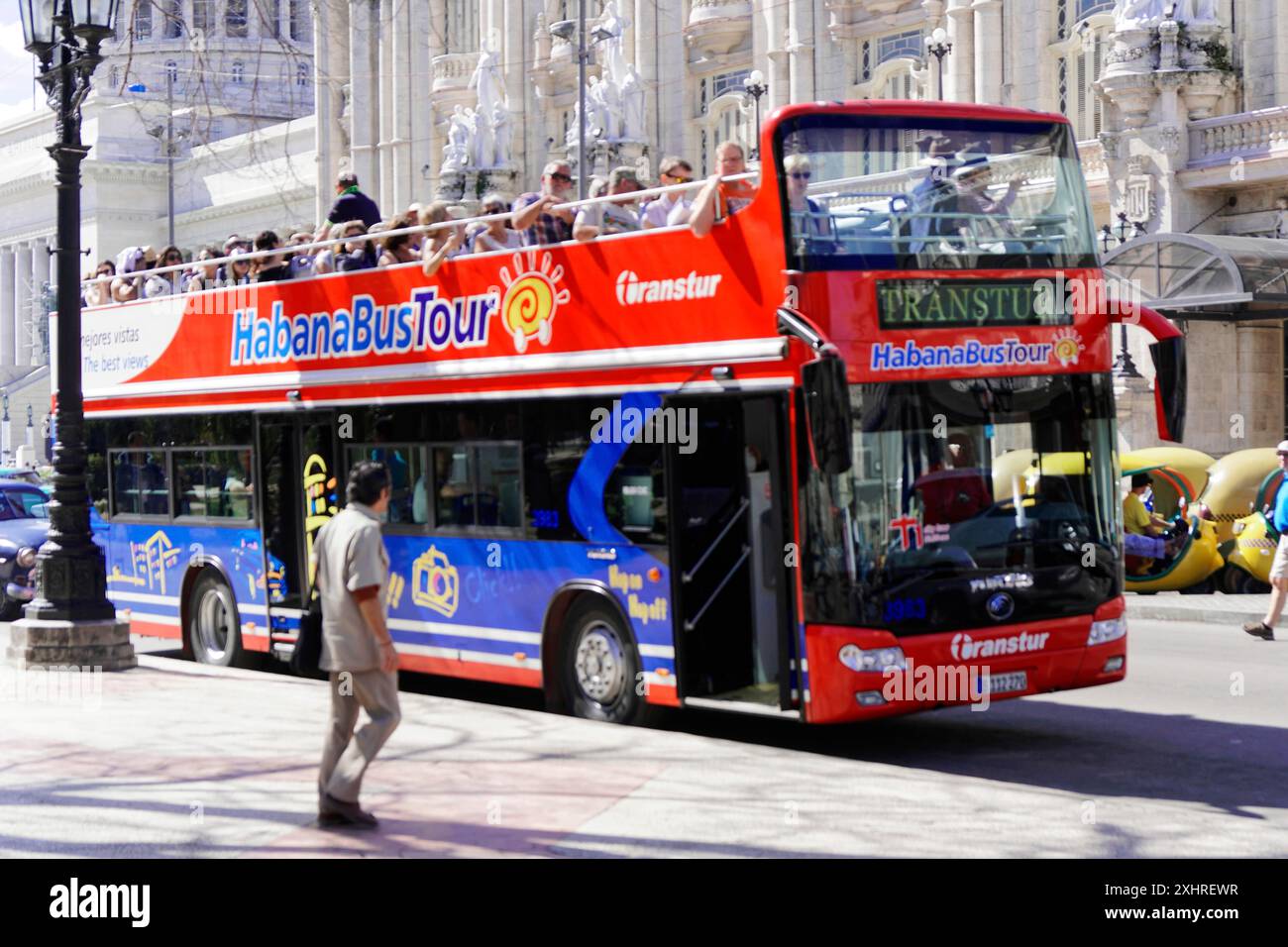 Havana, Cuba, Central America, A tourist double-decker bus drives ...