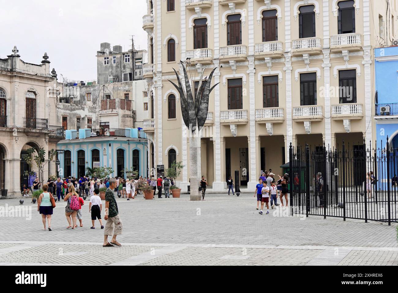 Havana, Cuba, Central America, square with historic buildings and many people walking around ...