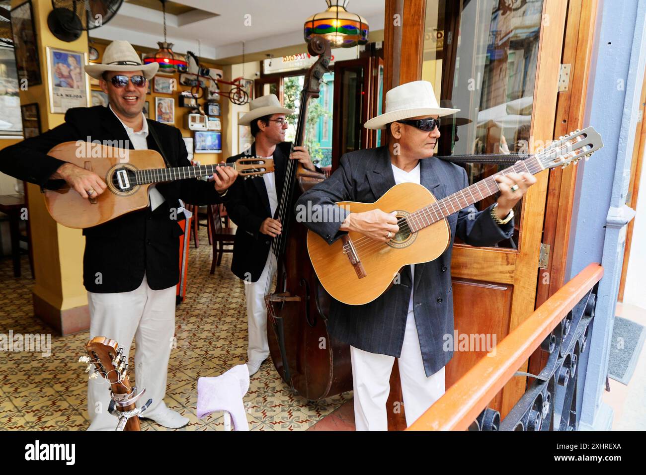Havana, Cuba, Central America, musicians play live music in a cafe ...