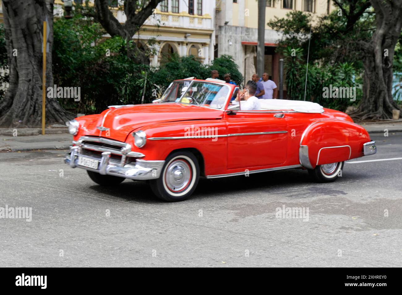 Havana, Cuba, Central America, retro convertible in red driving on a ...