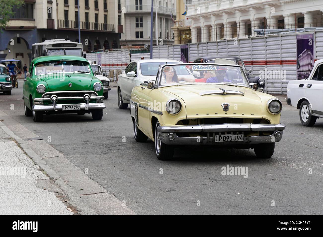 Havana, Cuba, Central America, Beige vintage convertible and green car ...