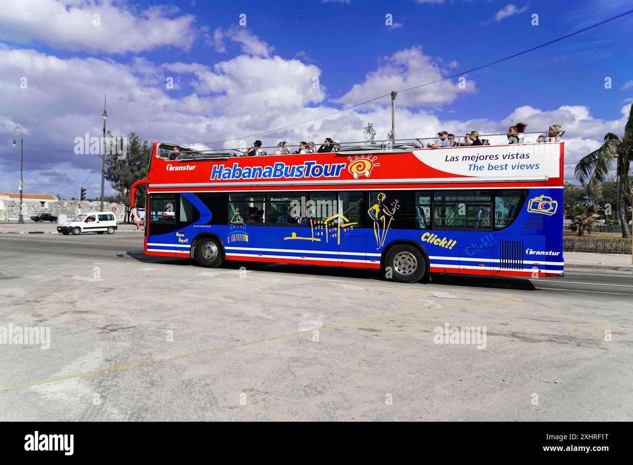 Tourist bus for city tours on a road, Cuba, Greater Antilles, Caribbean ...