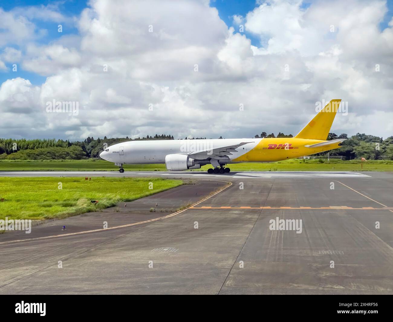 Cargo plane aeroplane jet plane with logo of DHL Paket GmbH stands on ...