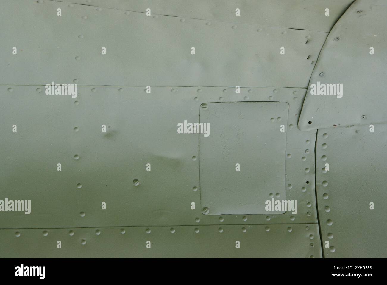 Old metal skin with rivets on an airplane. Armor of military equipment ...