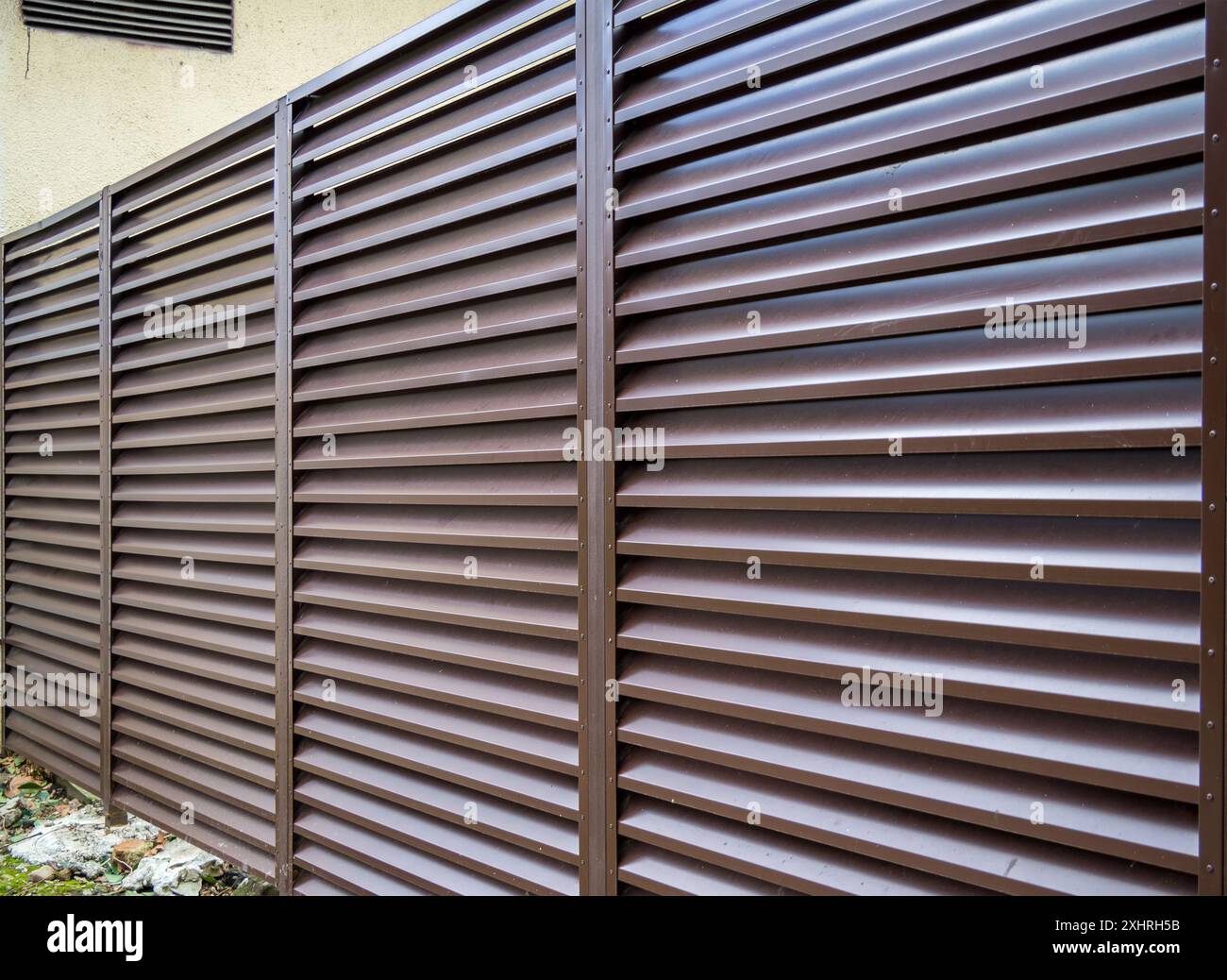 Fragment of a horizontal metal picket fence Stock Photo - Alamy