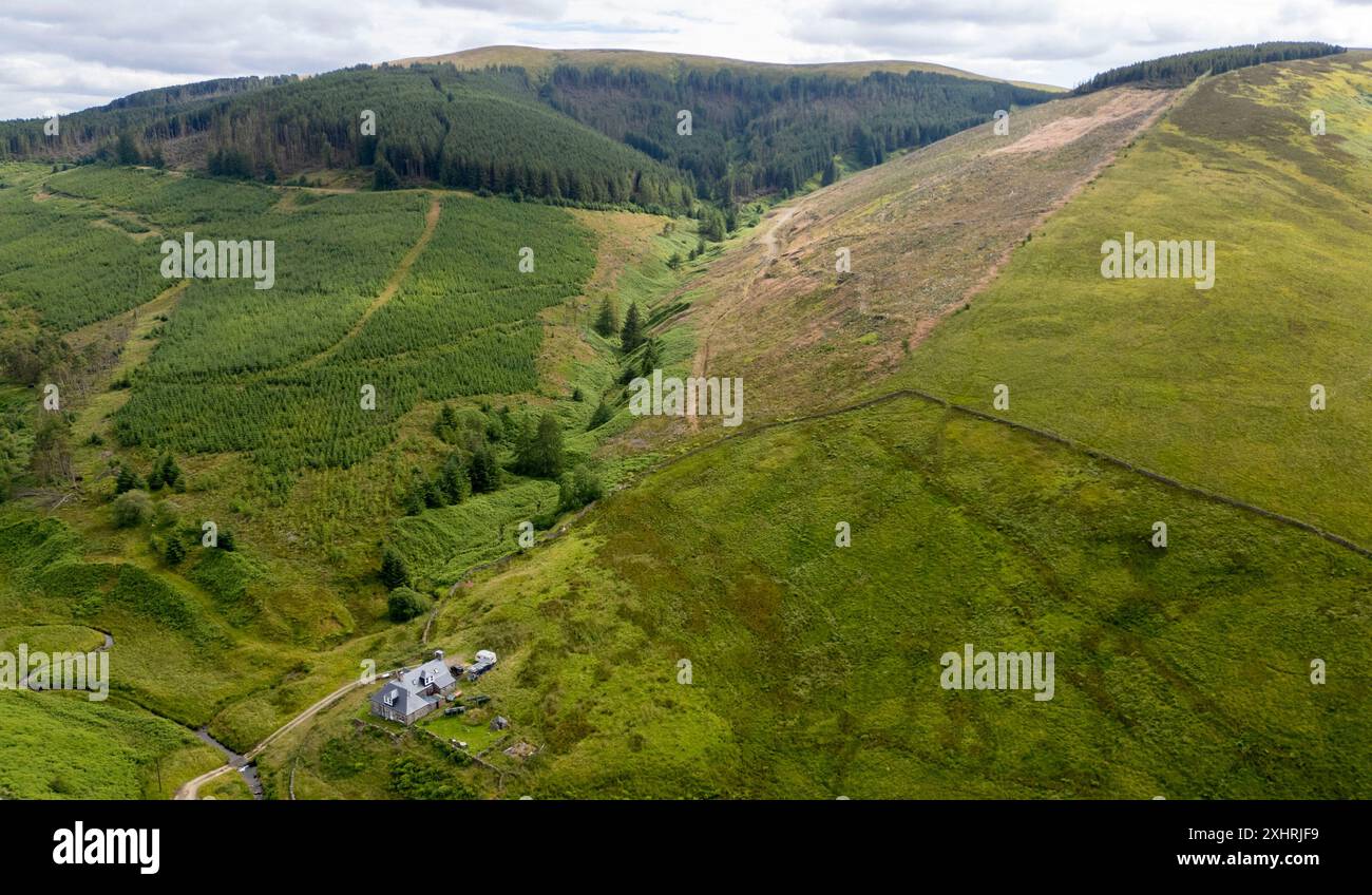 Aerial view of the Shiel cottage and Priesthaugh forest on the slopes ...