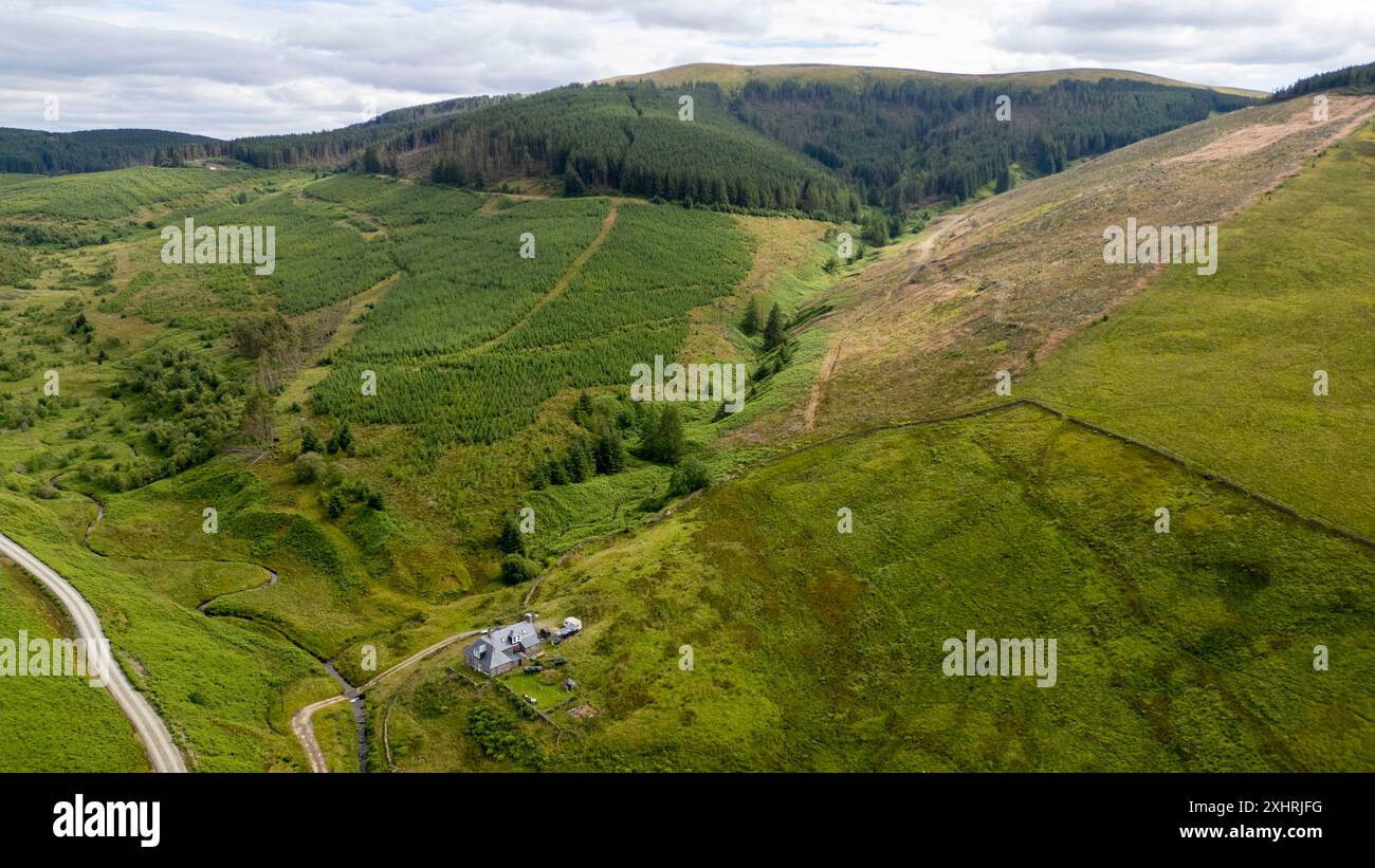 Aerial view of the Shiel cottage and Priesthaugh forest on the slopes ...