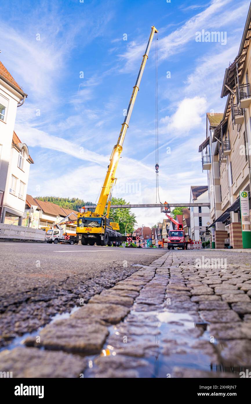 A lifting crane on a road similar to a construction site with ...