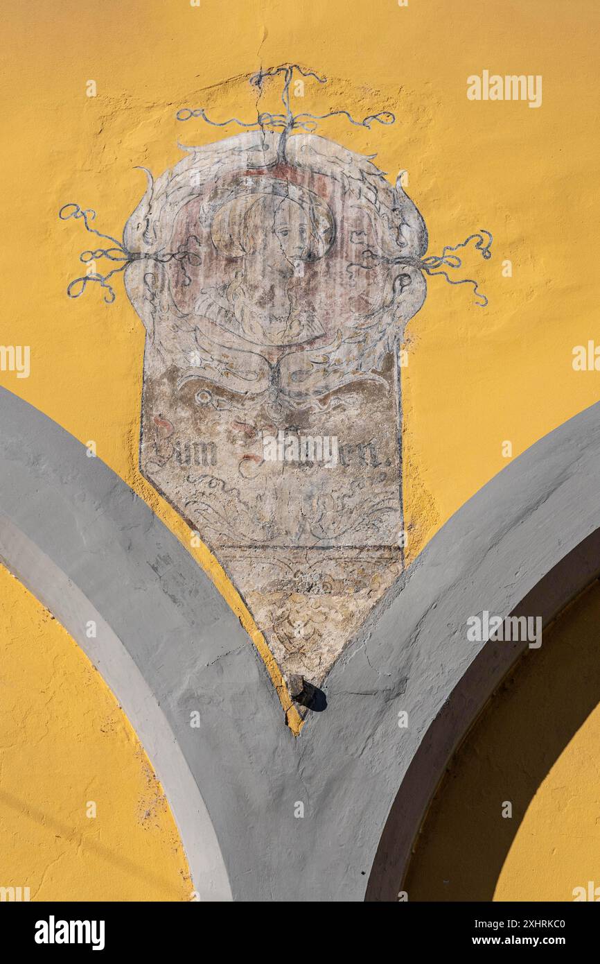 Original medieval facade painting on a historic building in the old ...