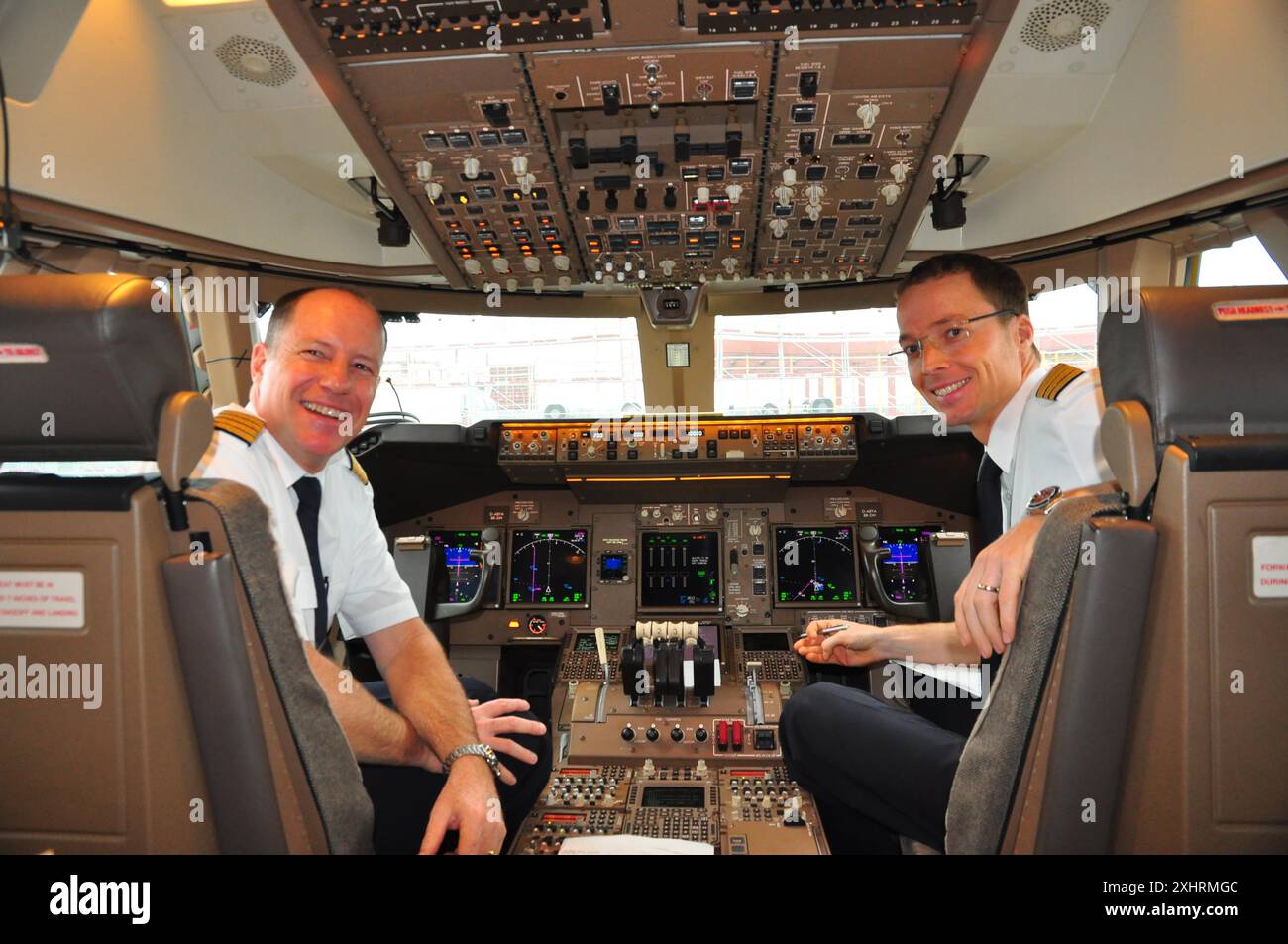 Lufthansa pilot and first officer in the cockpit of the Boeing 747-8 ...