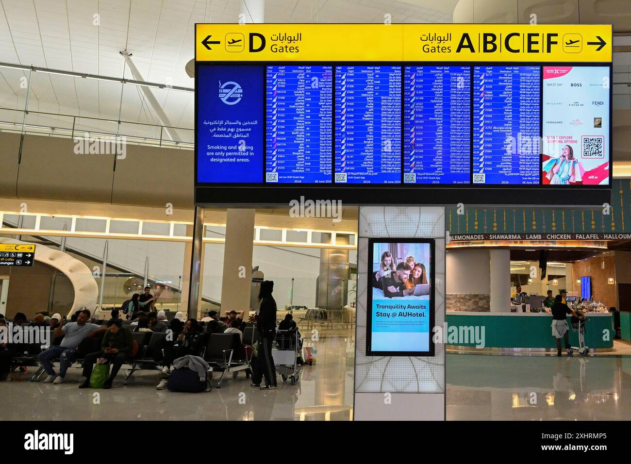 Airport scoreboard departures, Abu Dhabi, UAE Stock Photo - Alamy