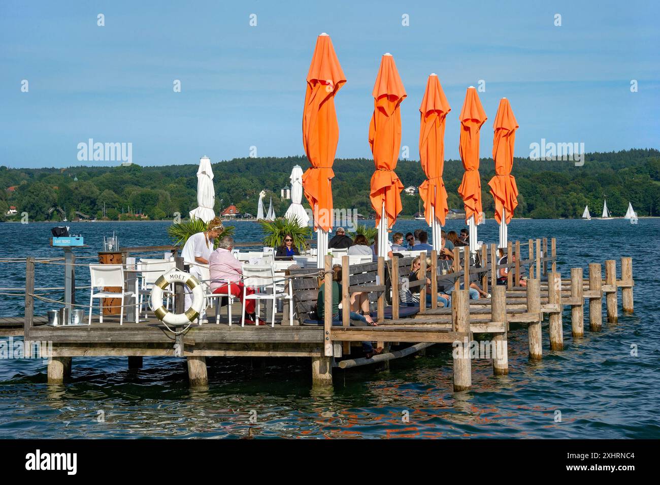 Old jetties with dining tables, lakeside restaurant, former Undosa wave ...