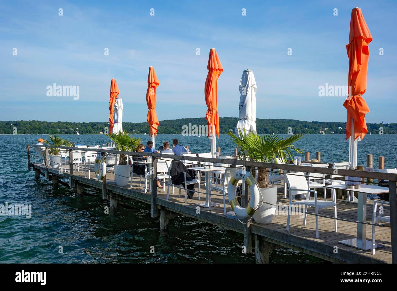 Old jetties with dining tables, lakeside restaurant, former Undosa wave ...