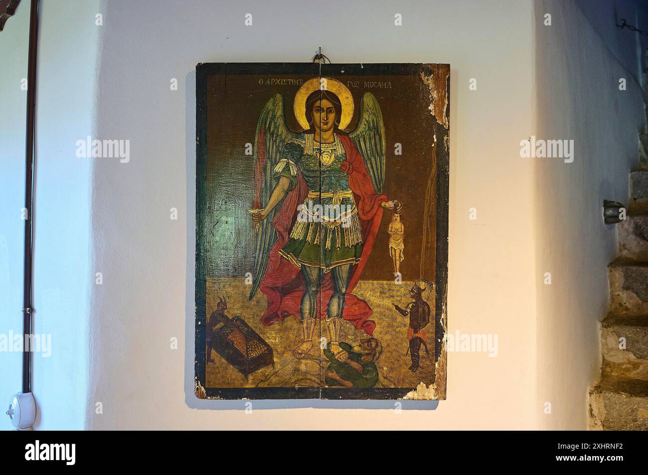 A religious painting shows an angel in traditional depiction, as a wall ...