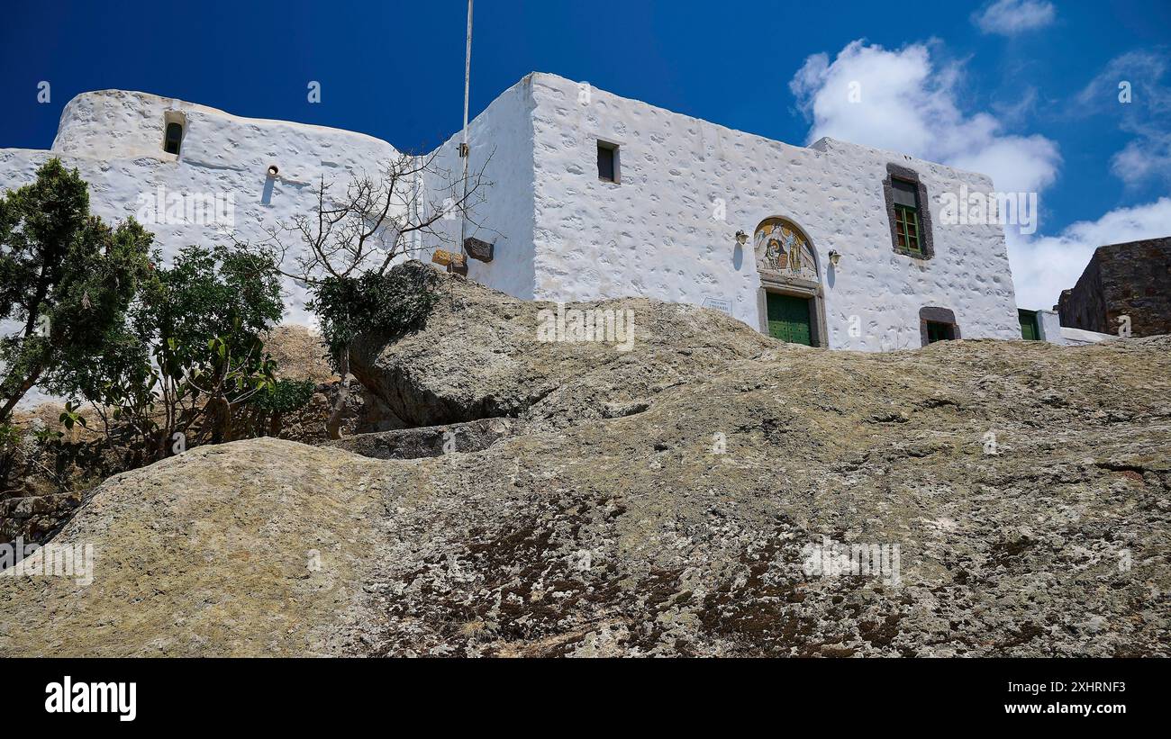 Whitewashed building on a rock under a clear blue sky, Monastery tis ...