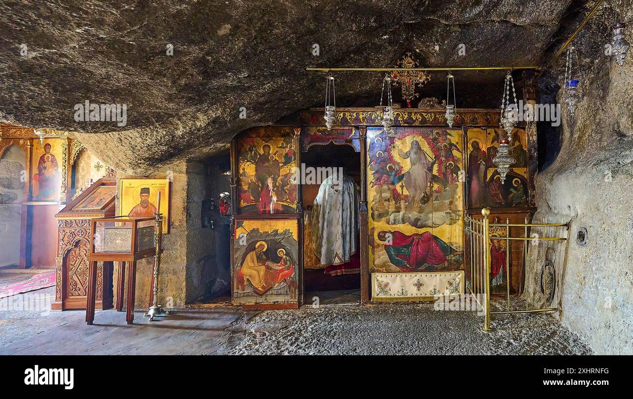 A church interior with religious icons, sacred paintings and an altar ...