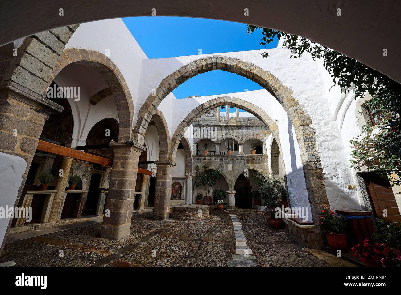 Historic courtyard of a monastery with arches and stone structures ...