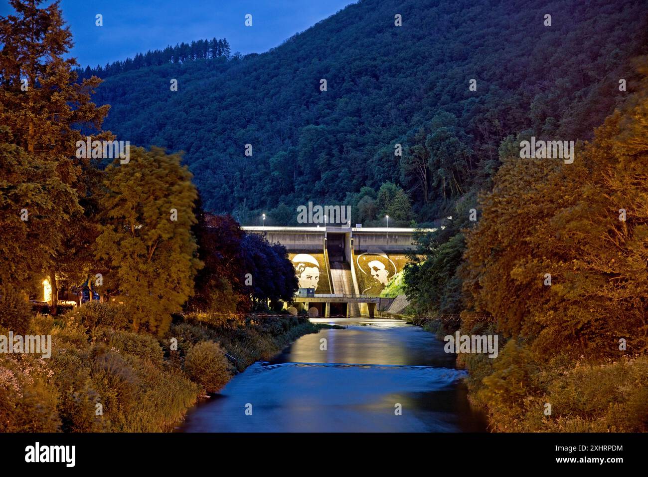 The dammed river Our with art on the illuminated dam wall of the lower ...