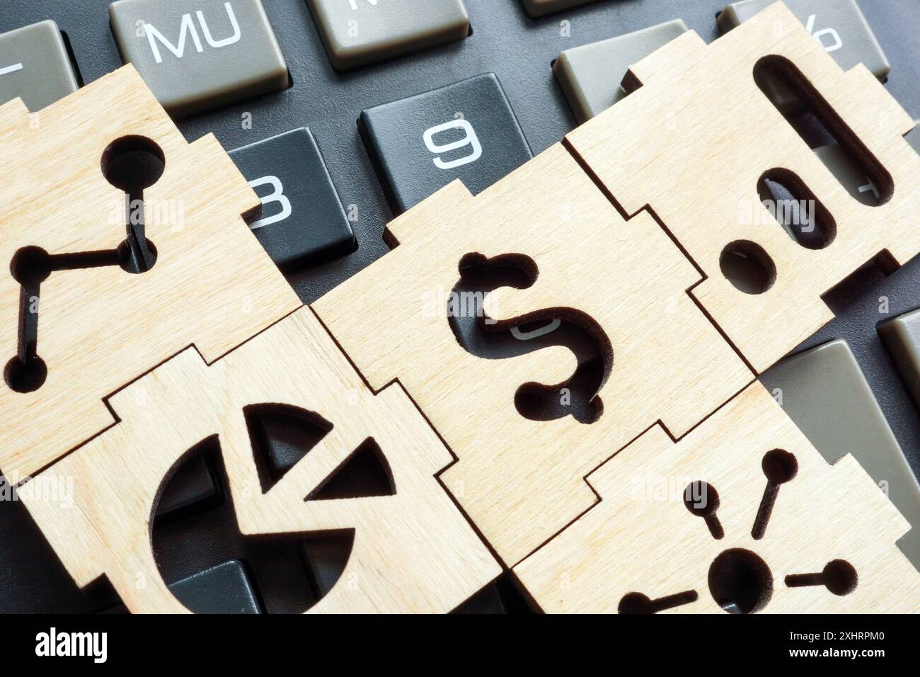 Financial symbols puzzle on calculator. Business reporting and ...