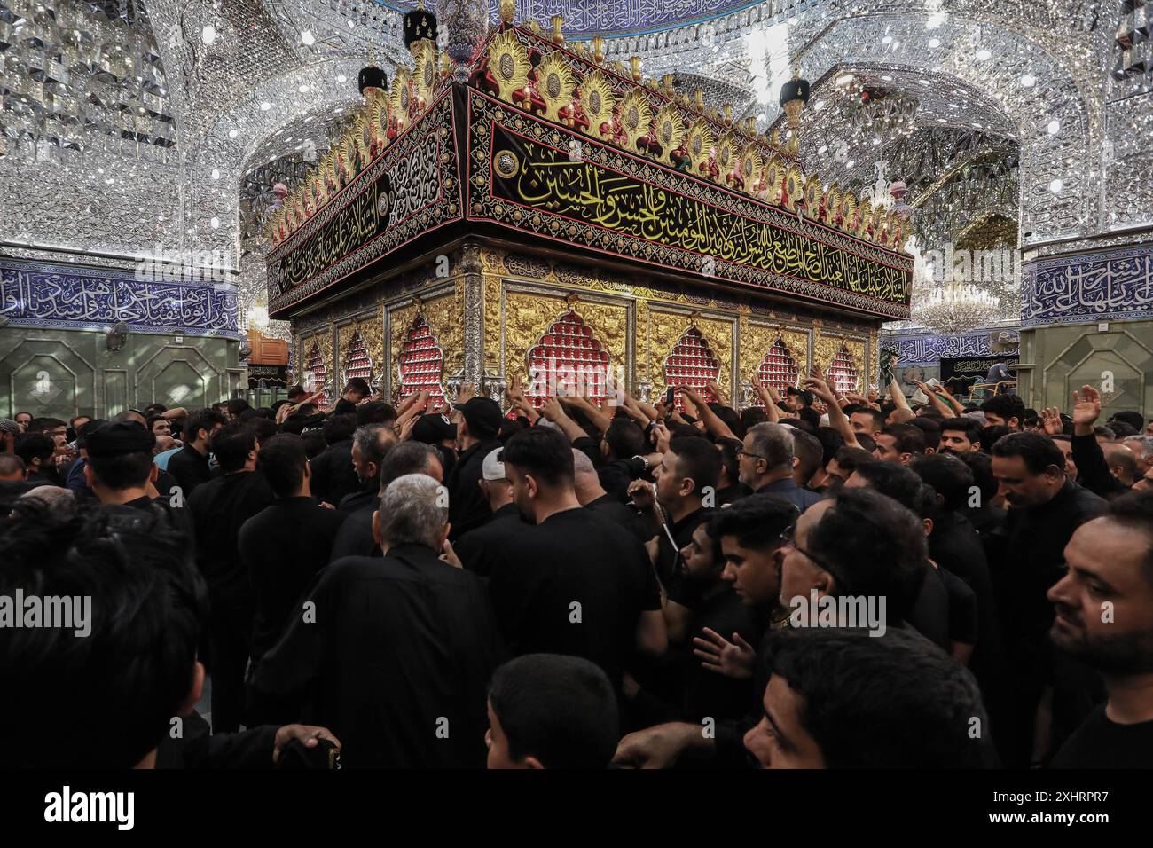 Karbalaa, Iraq. 15th July, 2024. Iraqi Shiite Muslims gather at the ...