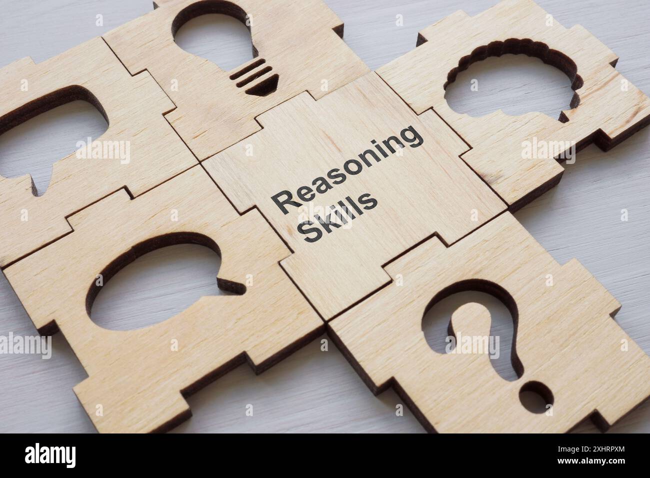 Puzzle pieces and one with words Reasoning skills Stock Photo - Alamy