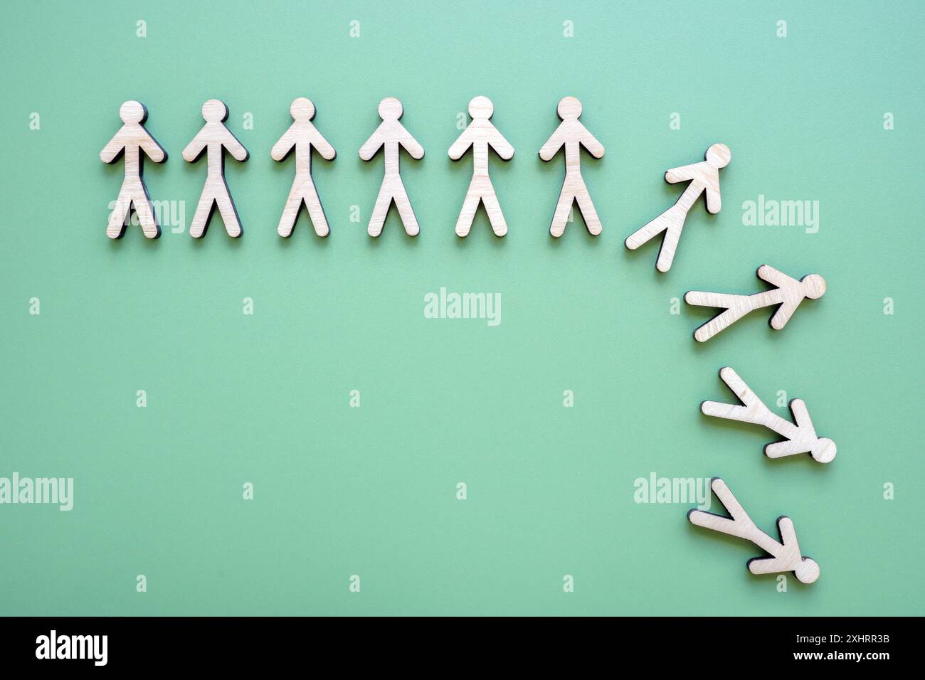 Abstract line of falling figures as employee turnover Stock Photo - Alamy