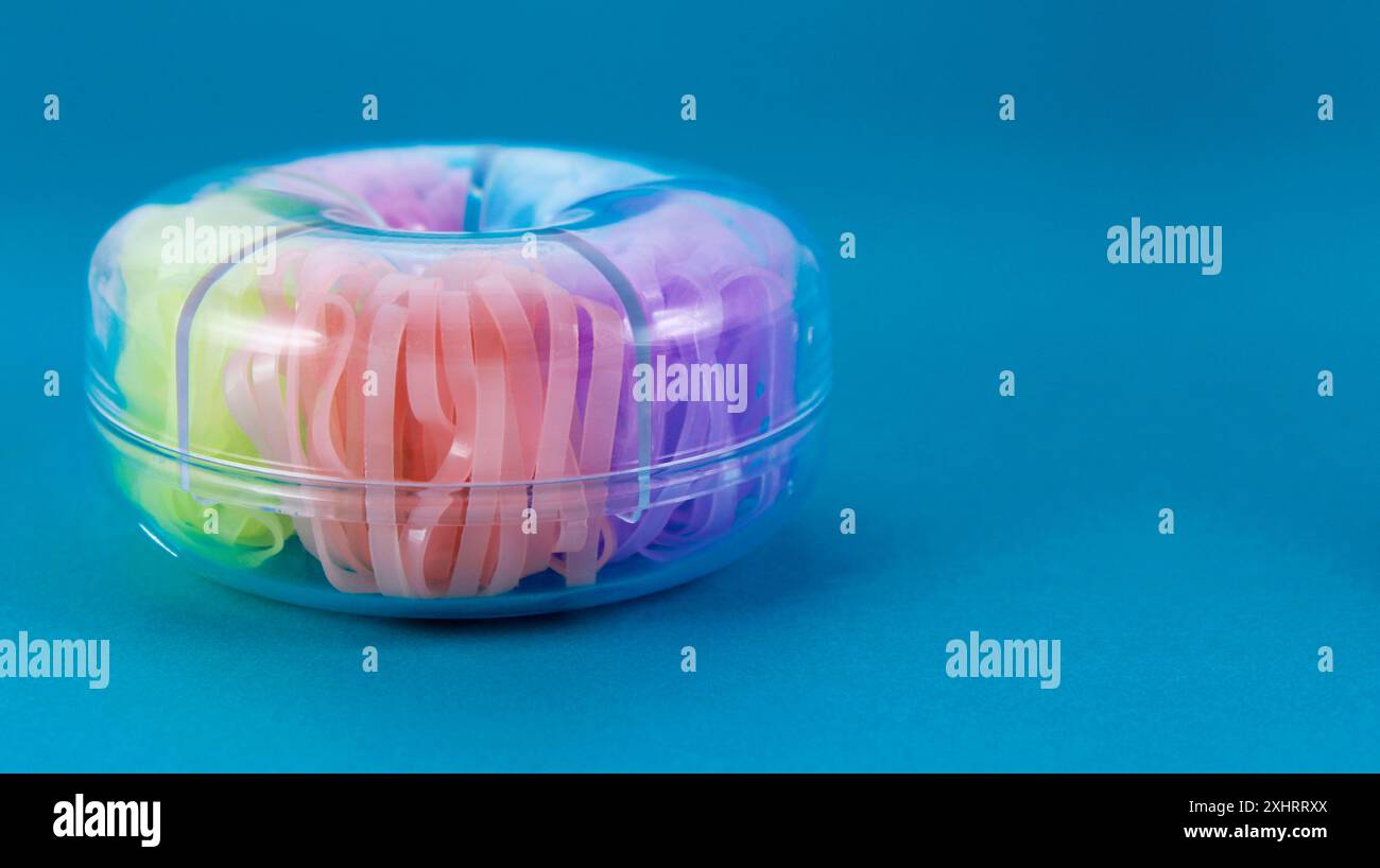Container with colorful rubber bands Stock Photo - Alamy