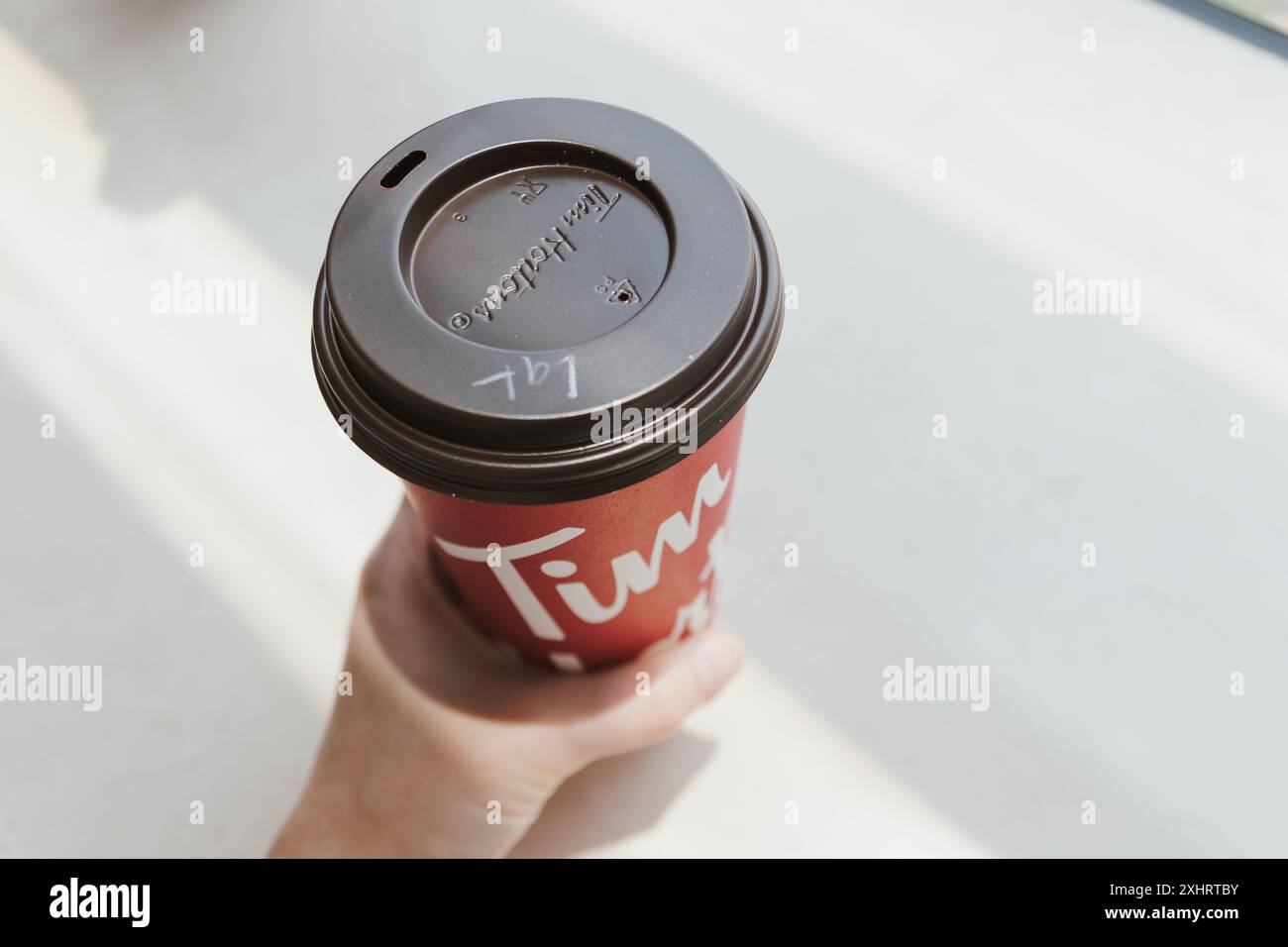 DUBAI, UAE - 9 AUGUST 2020: Tim Hortons takeaway red coffee cup with ...