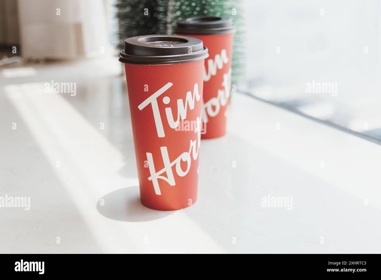 DUBAI, UAE - 9 AUGUST 2020: Tim Hortons takeaway red coffee cups with ...