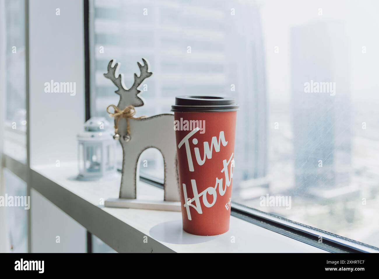 DUBAI, UAE - 9 AUGUST 2020: Tim Hortons takeaway red coffee cups with ...