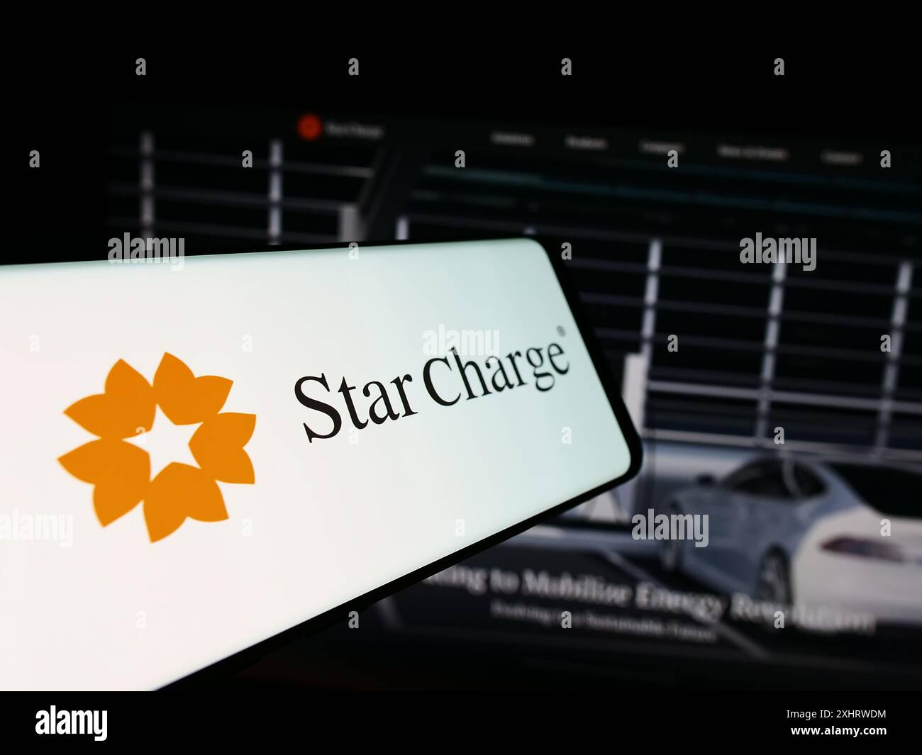 Cellphone with logo of Singaporean electric vehicle charging company ...