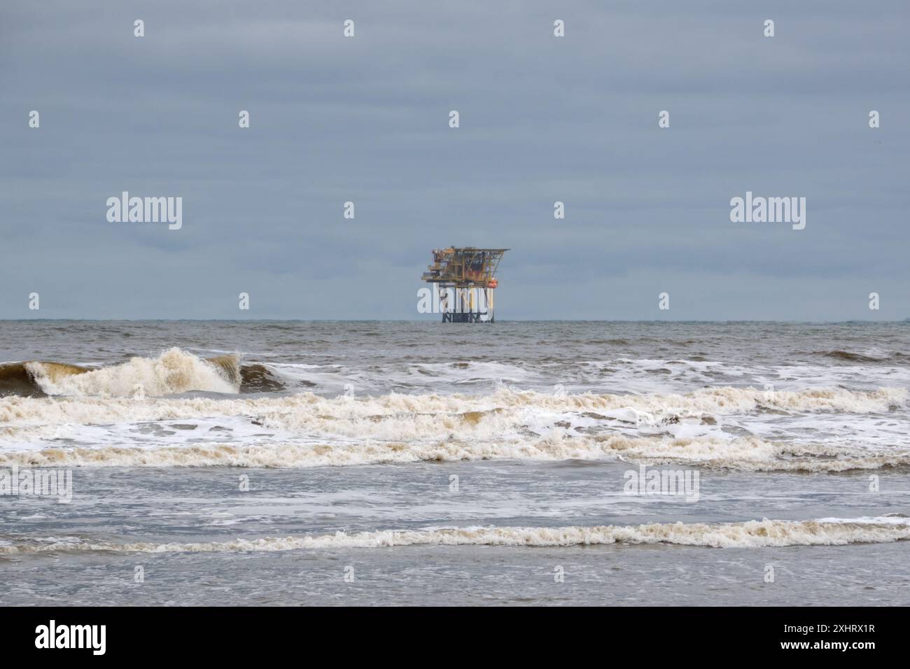 Offshore production platform near the Dutch island Ameland, surfs near ...