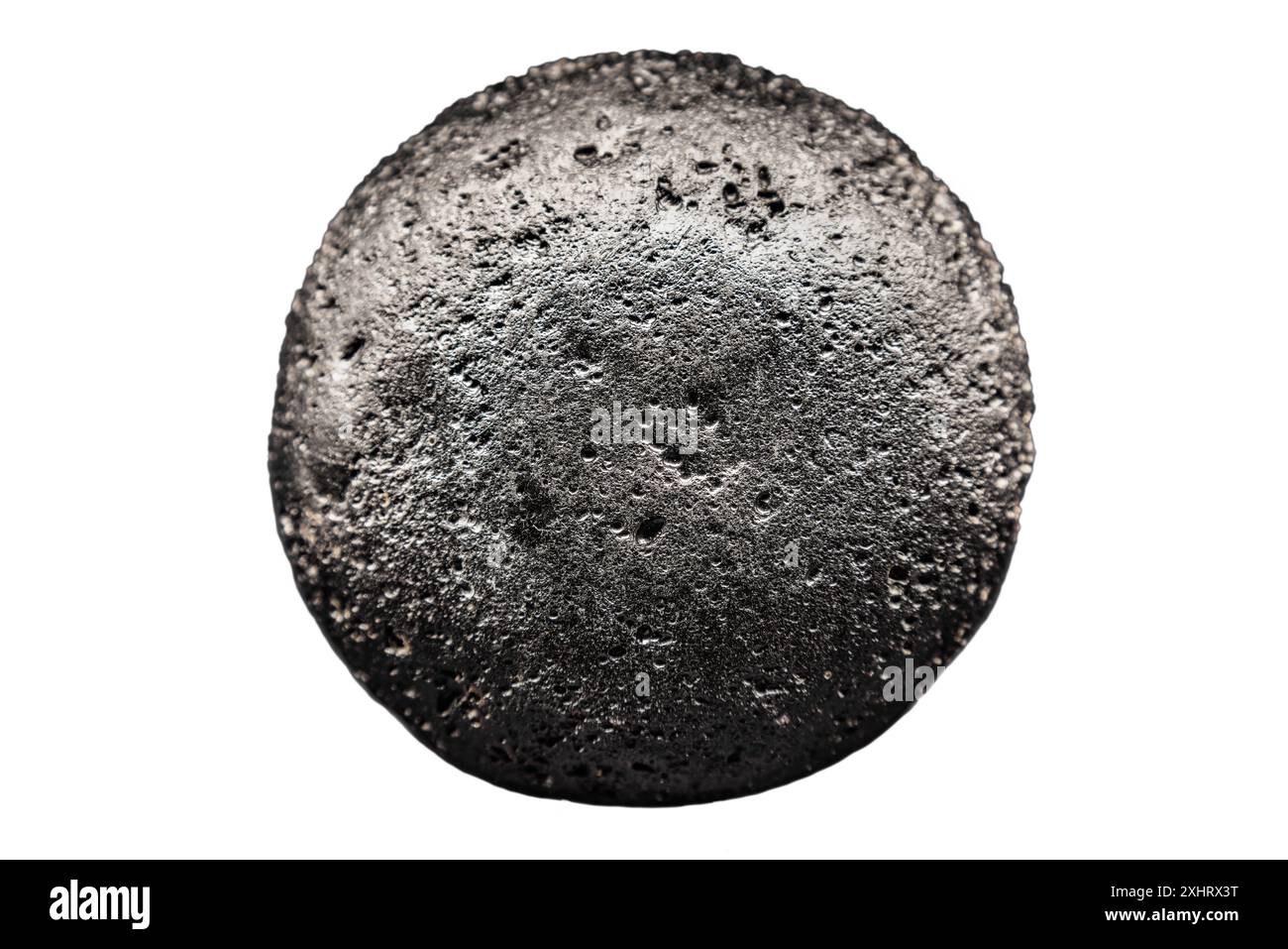 Natural meteorite specimen, black stone rock rounded by the friction of ...