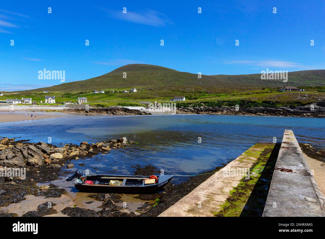 A traditional currach in Dooega harbour ,on the Atlantic Drive on ...
