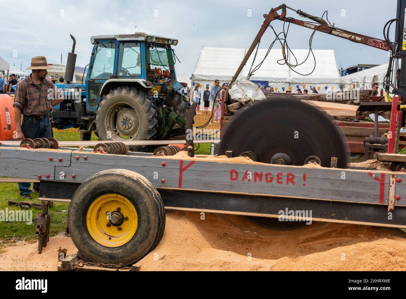 vintage tractor powered agricultural commercial saw mill operating at ...