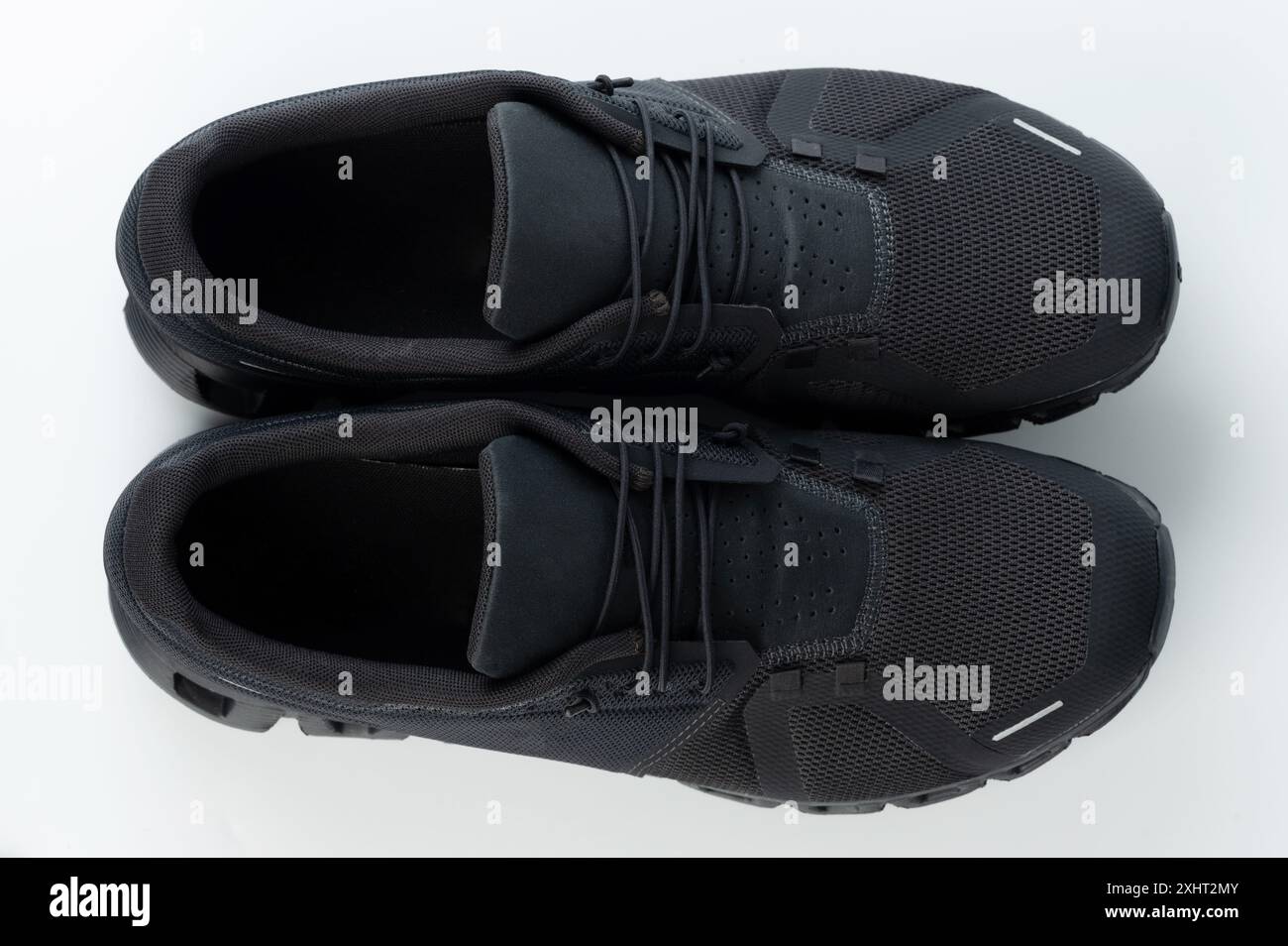 New black trainer shoes with laces above top view isolated Stock Photo ...