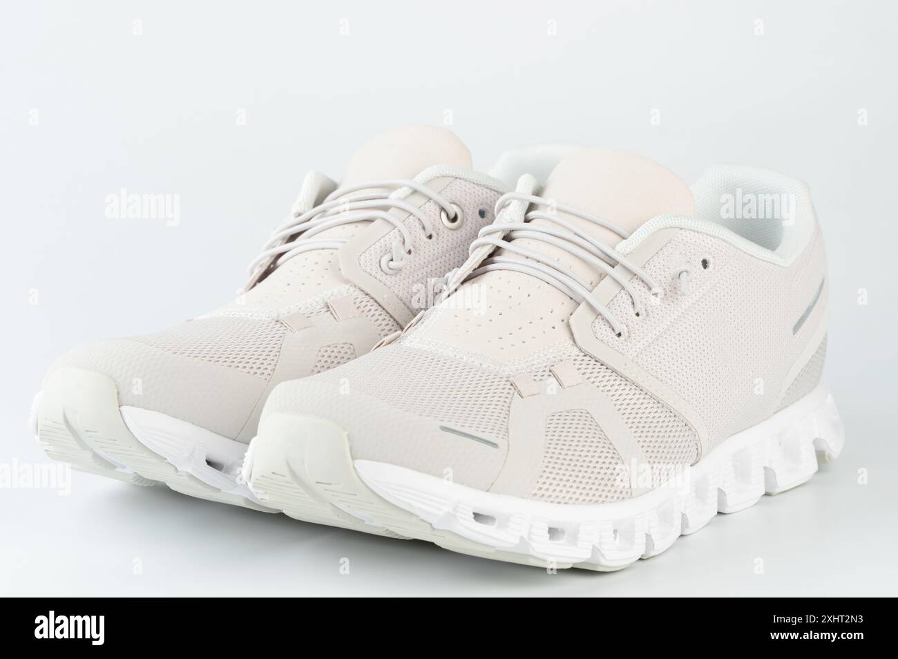 Perspective view on sport light pair shoes isolated on studio ...