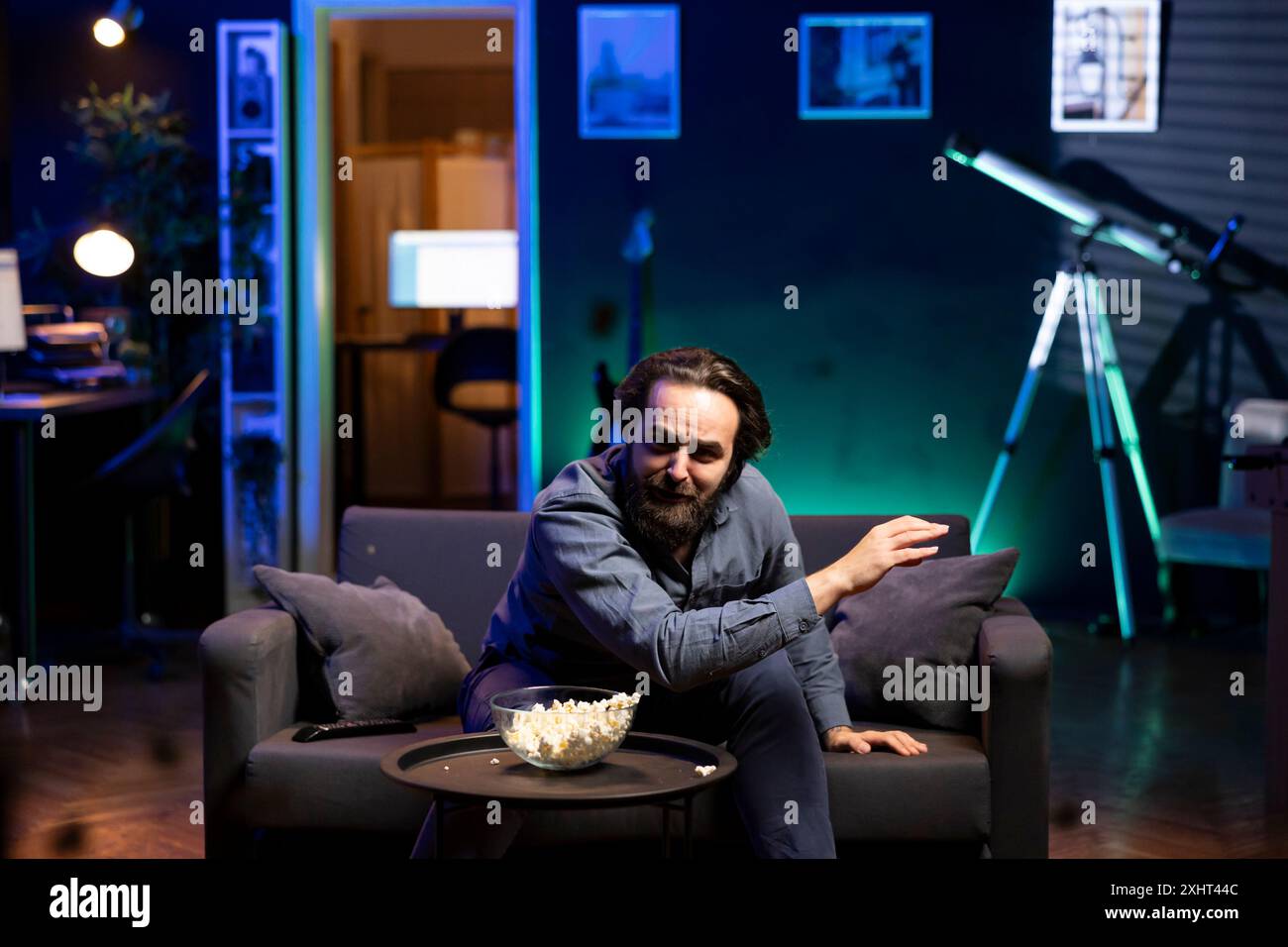 Sad man crying while watching drama movie on streaming service during ...