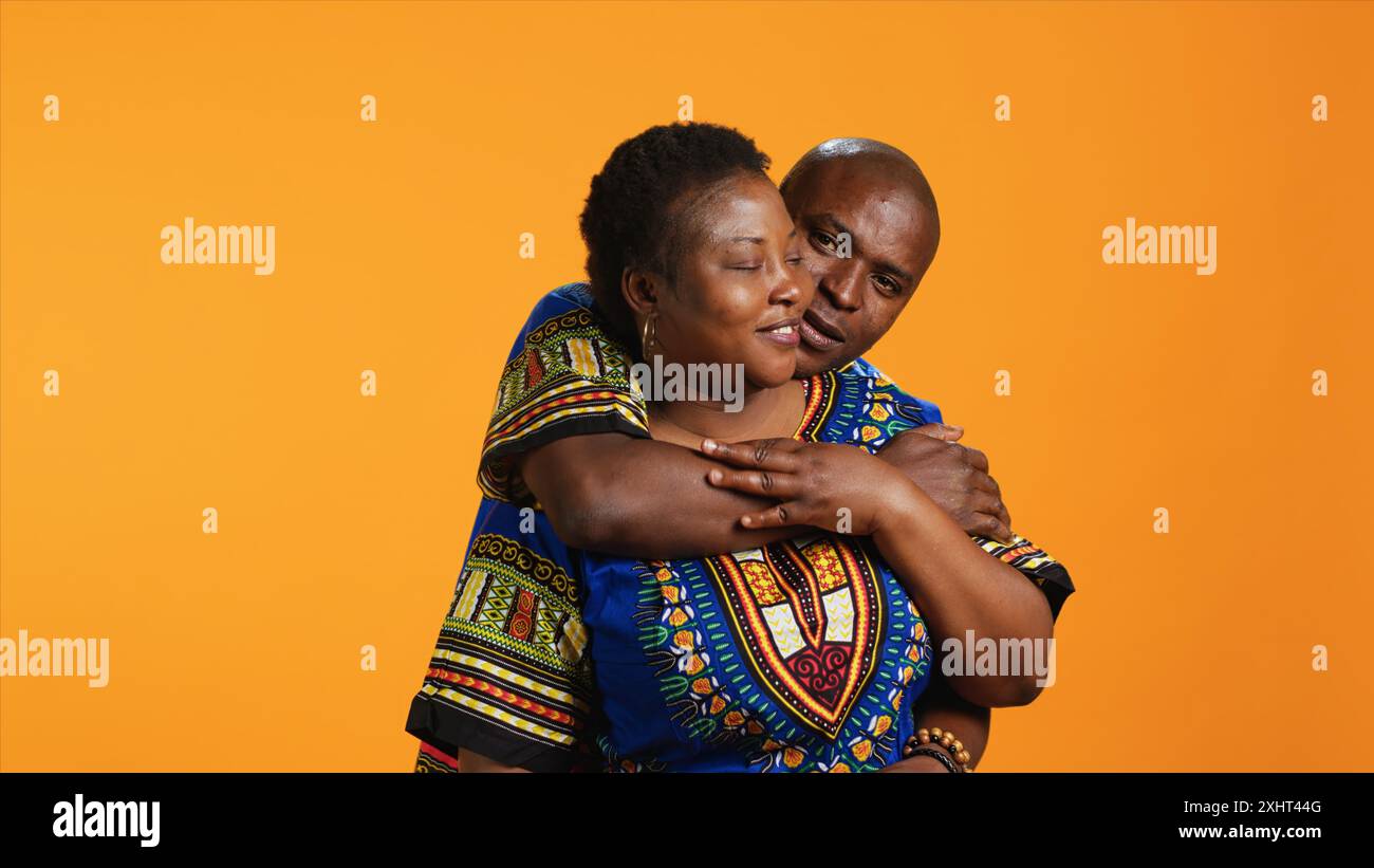 Loving husband embracing his wife in front of camera, showing sincere ...